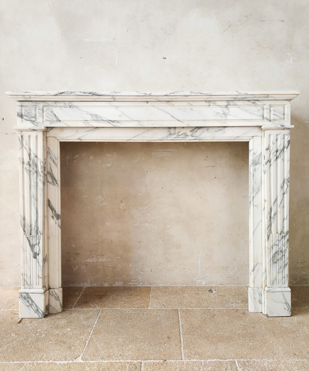 Antique white marble sleek fireplace - Piet Jonker
