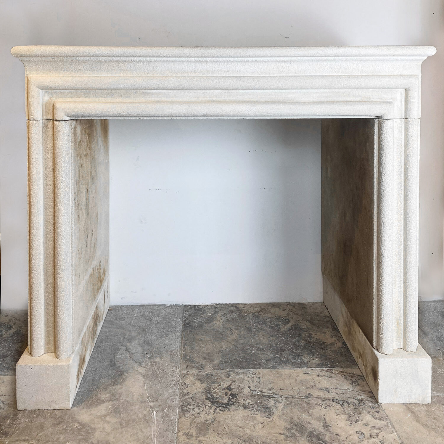Sleek French limestone fireplace model 1 - Piet Jonker