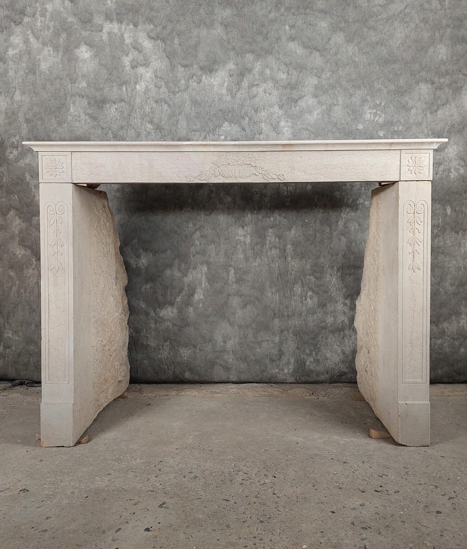 Antique limestone fireplace with rosets and flower ornaments - Piet Jonker