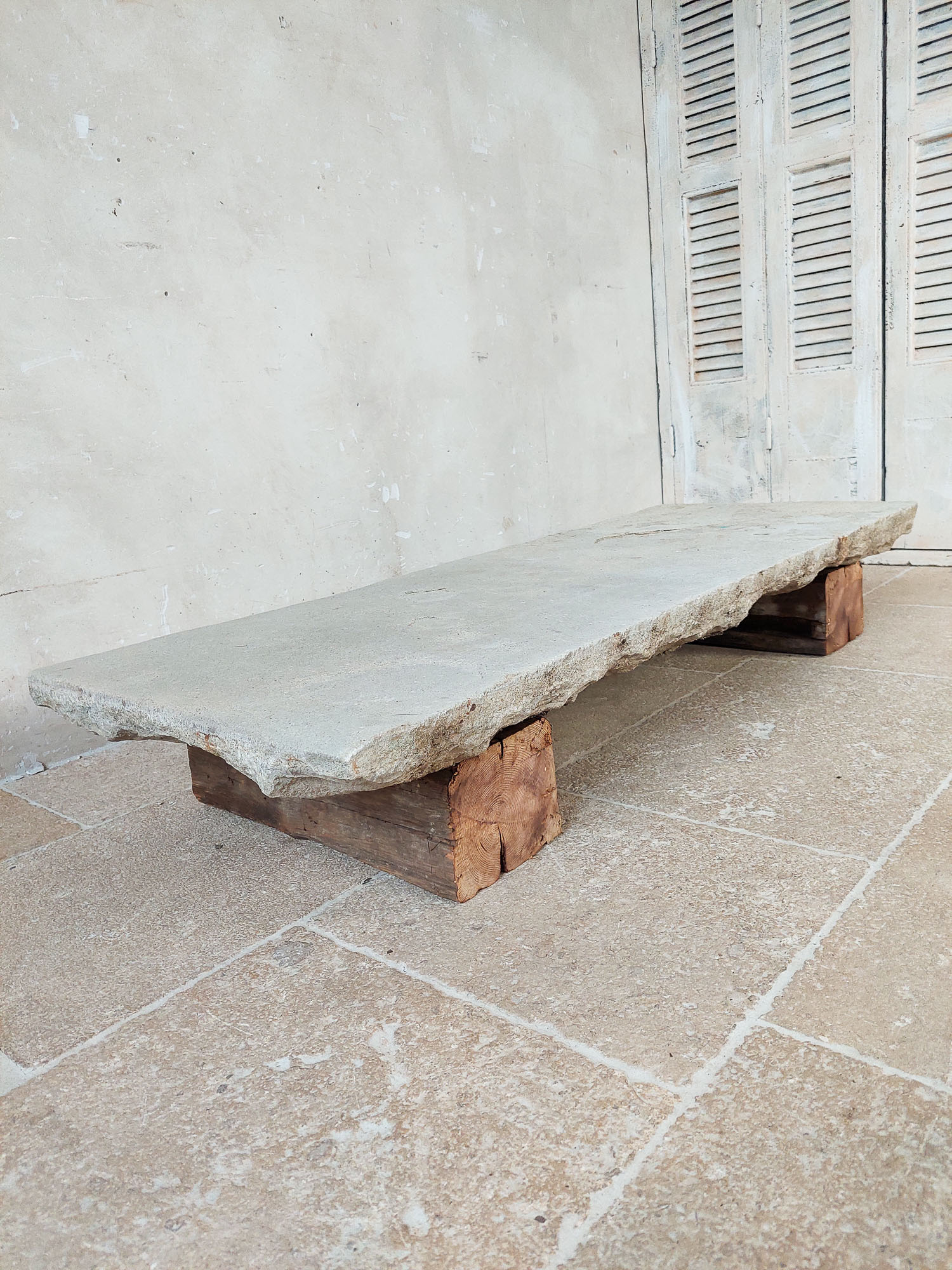 Antique Burgundian flagstone as a large low coffee table - Piet Jonker