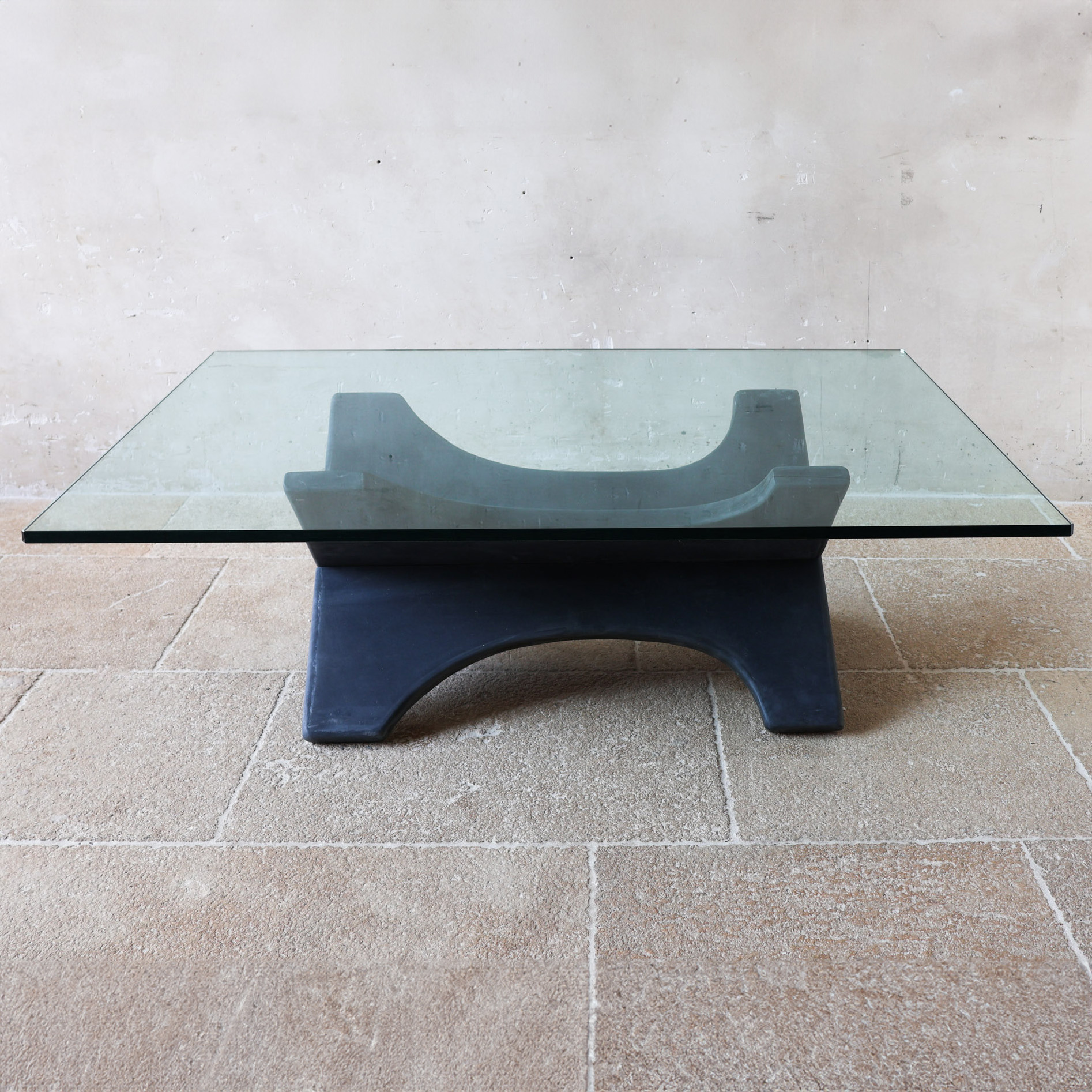 Coffee table with a solid slate base and a glass top - Piet Jonker
