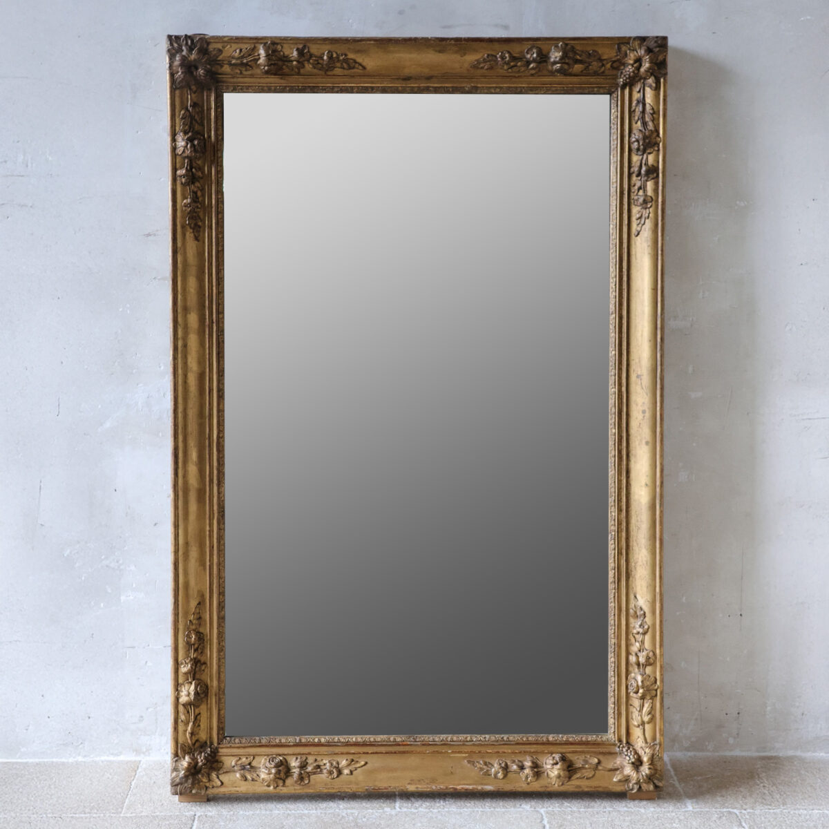 Antique rectangular gilded mirror featuring floral and leaf motifs ...