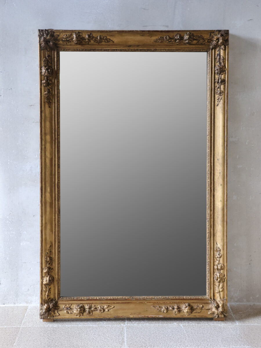 Antique rectangular gilded mirror featuring floral and leaf motifs ...