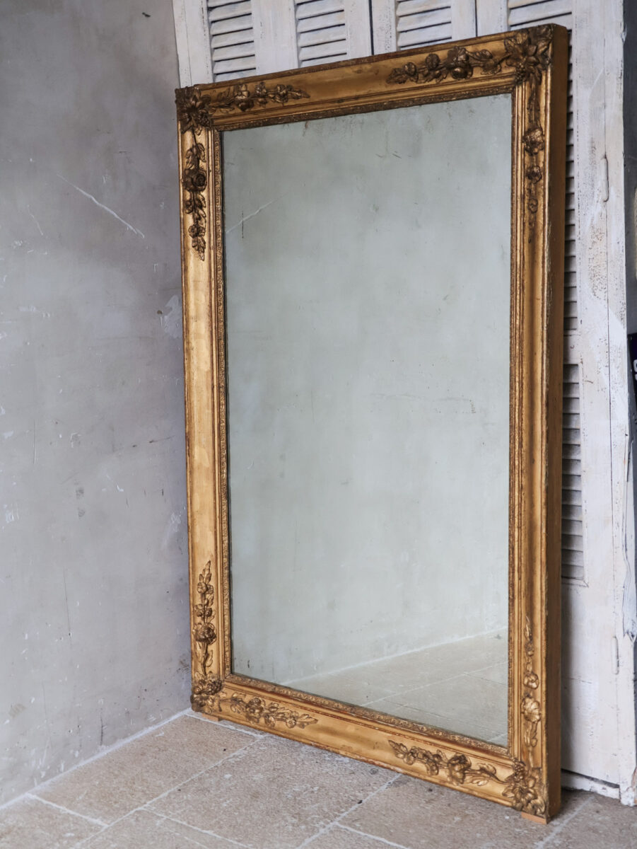 Antique rectangular gilded mirror featuring floral and leaf motifs ...