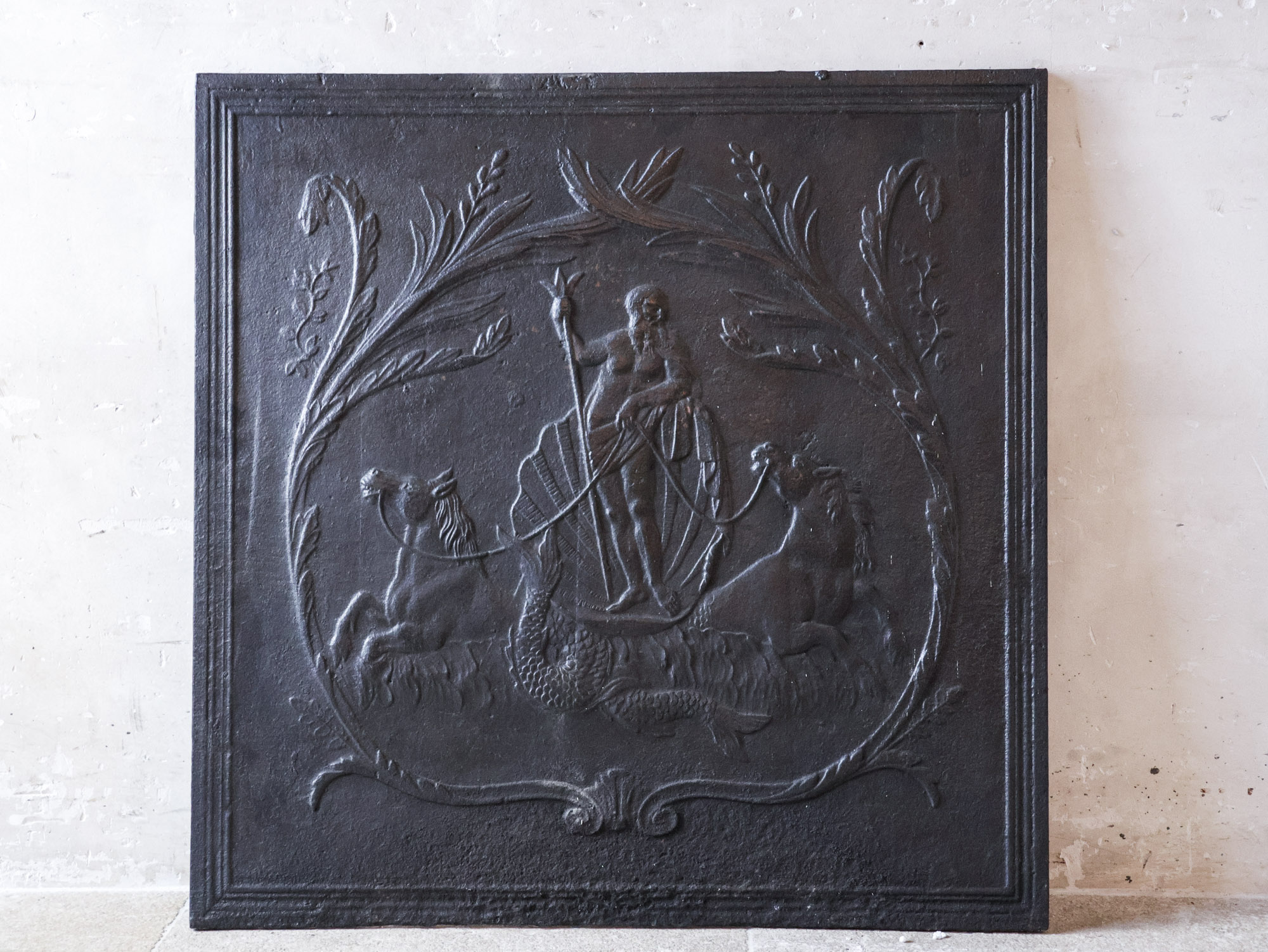Antique cast iron fireback with a mythological depiction of Poseidon ...