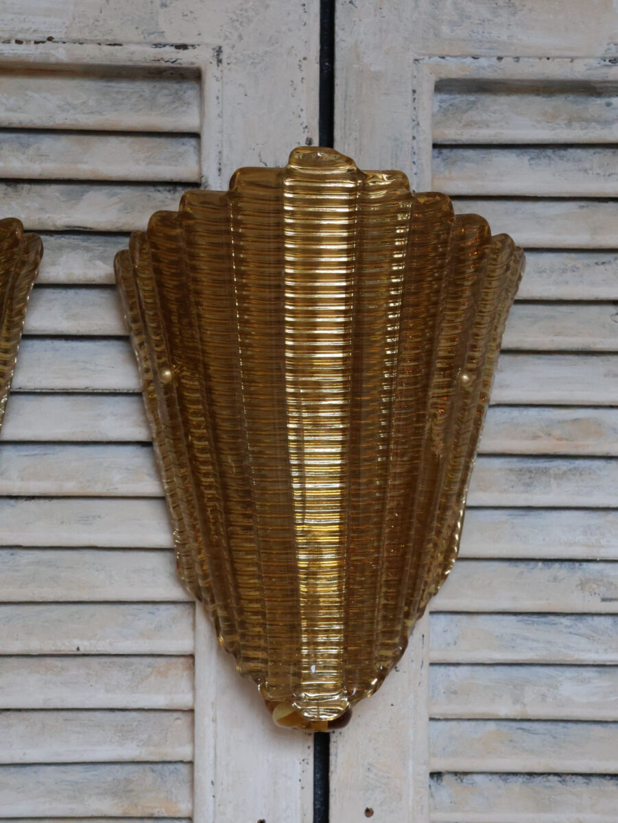 Pair of hand blown Murano shell wall lights amber glass and brass ...